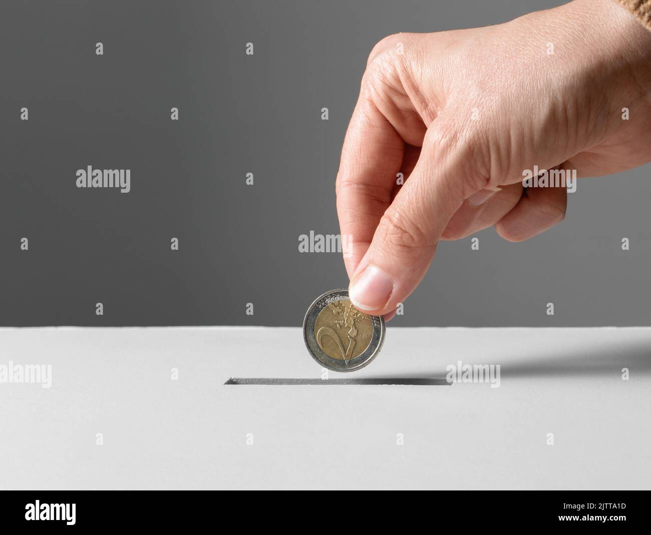 Coin money box hand hi-res stock photography and images - Alamy