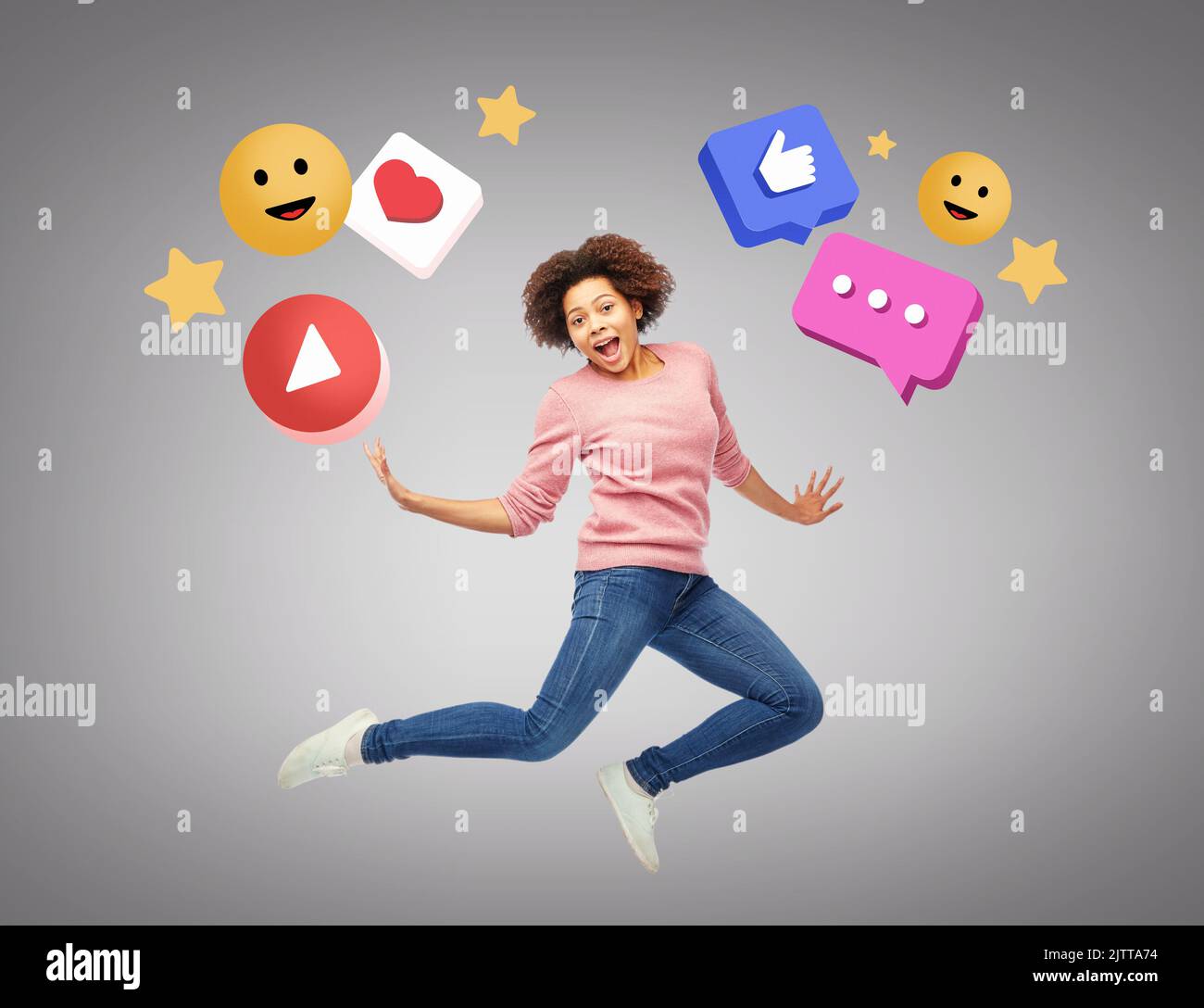 smiling young woman jumping over internet icons Stock Photo - Alamy