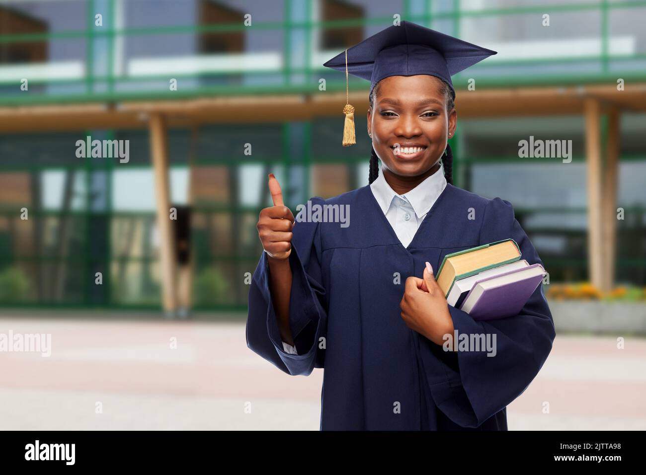 African graduate student books hi-res stock photography and images - Alamy