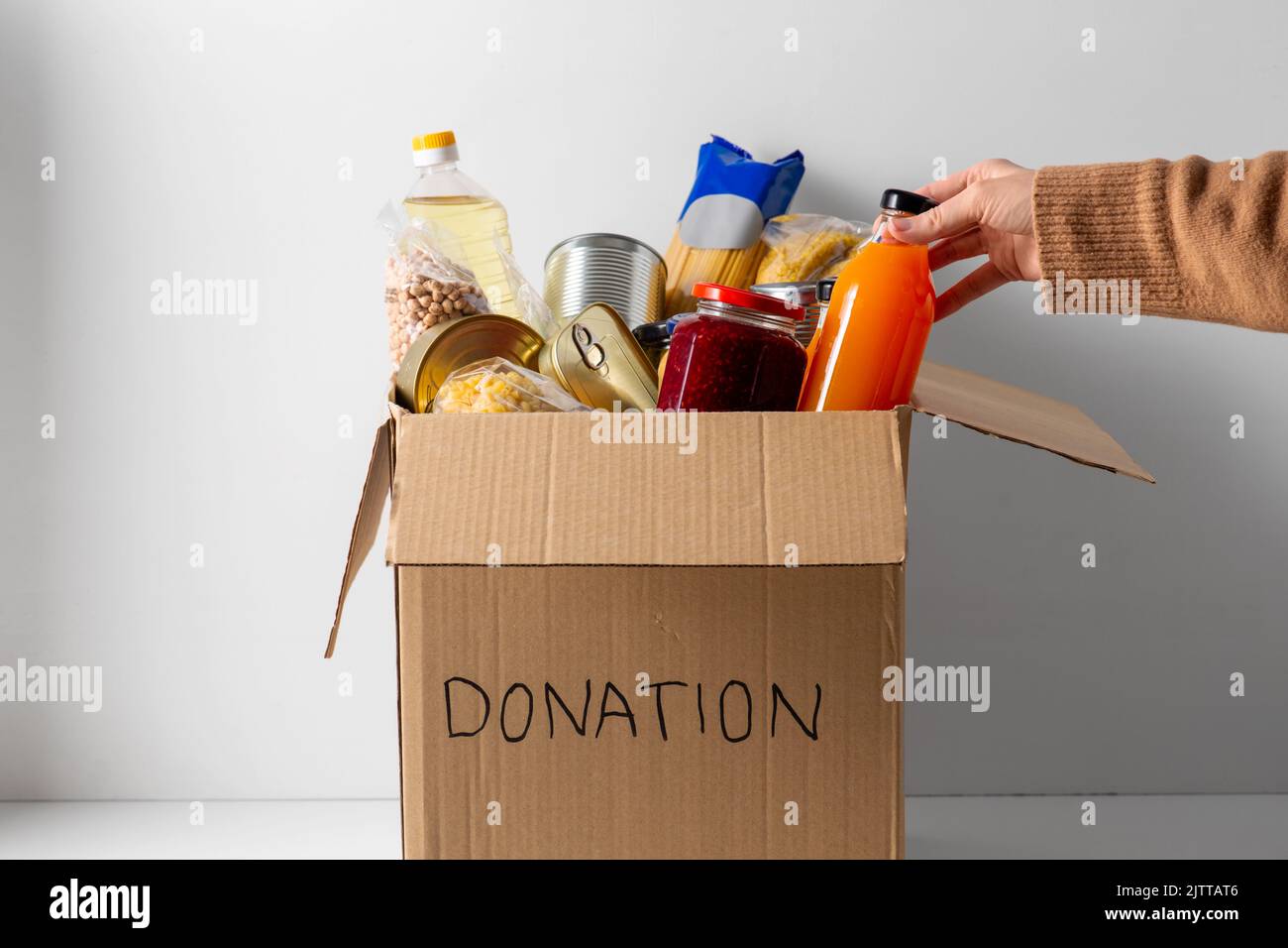 Putting hand in box hi-res stock photography and images - Alamy