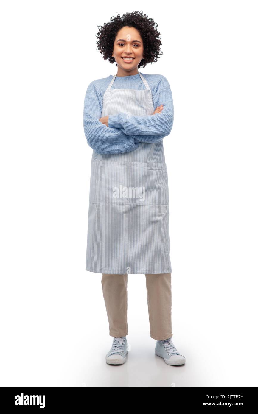 smiling woman in apron over white background Stock Photo - Alamy