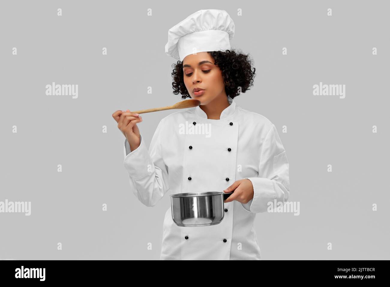 Female chef saucepan spoon hi-res stock photography and images - Alamy