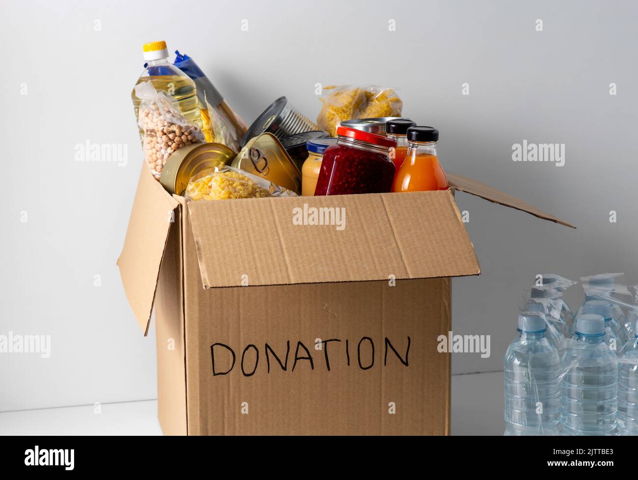 close up of food in donation box and water Stock Photo - Alamy