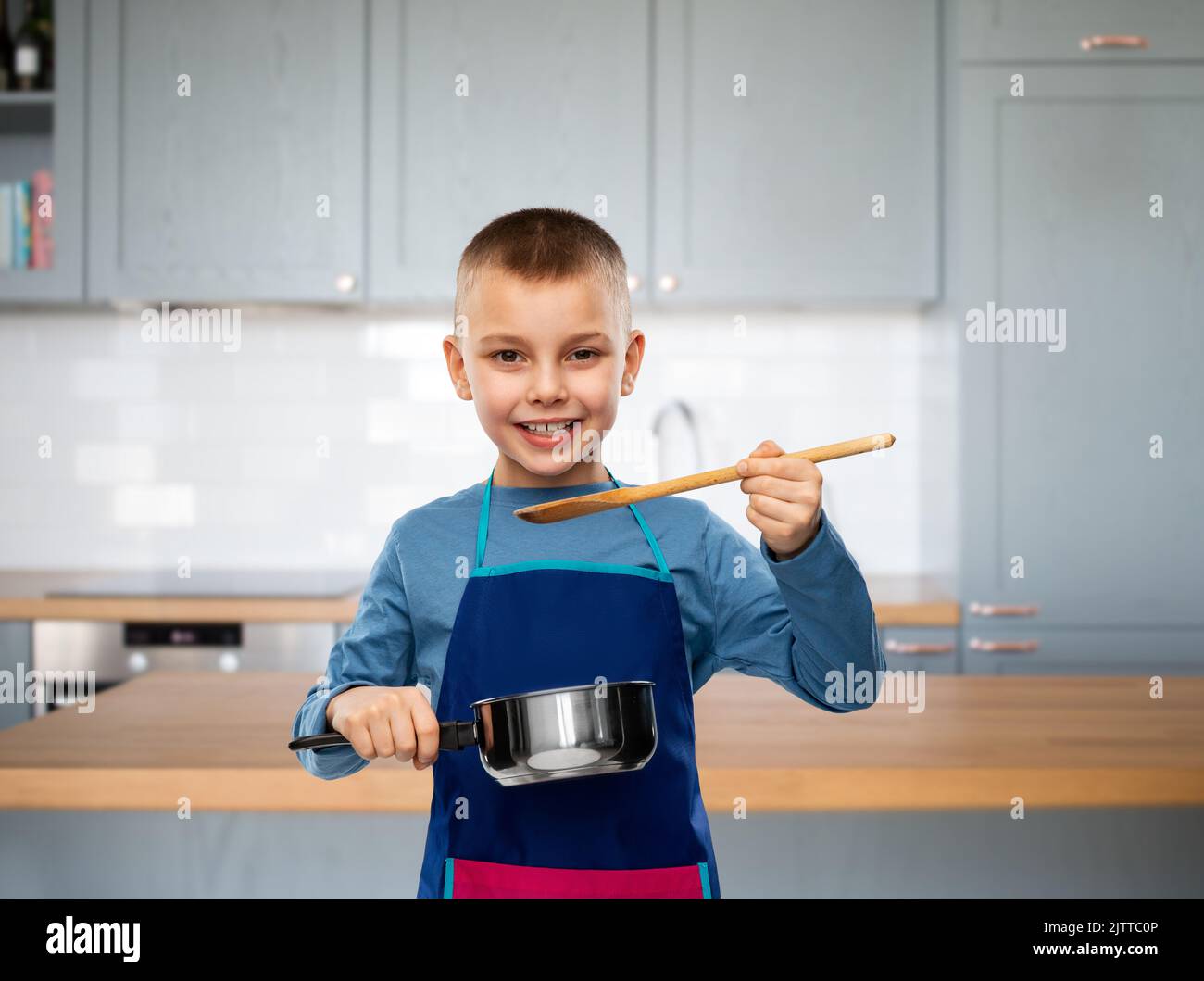 Teen boy cooking hi-res stock photography and images - Alamy