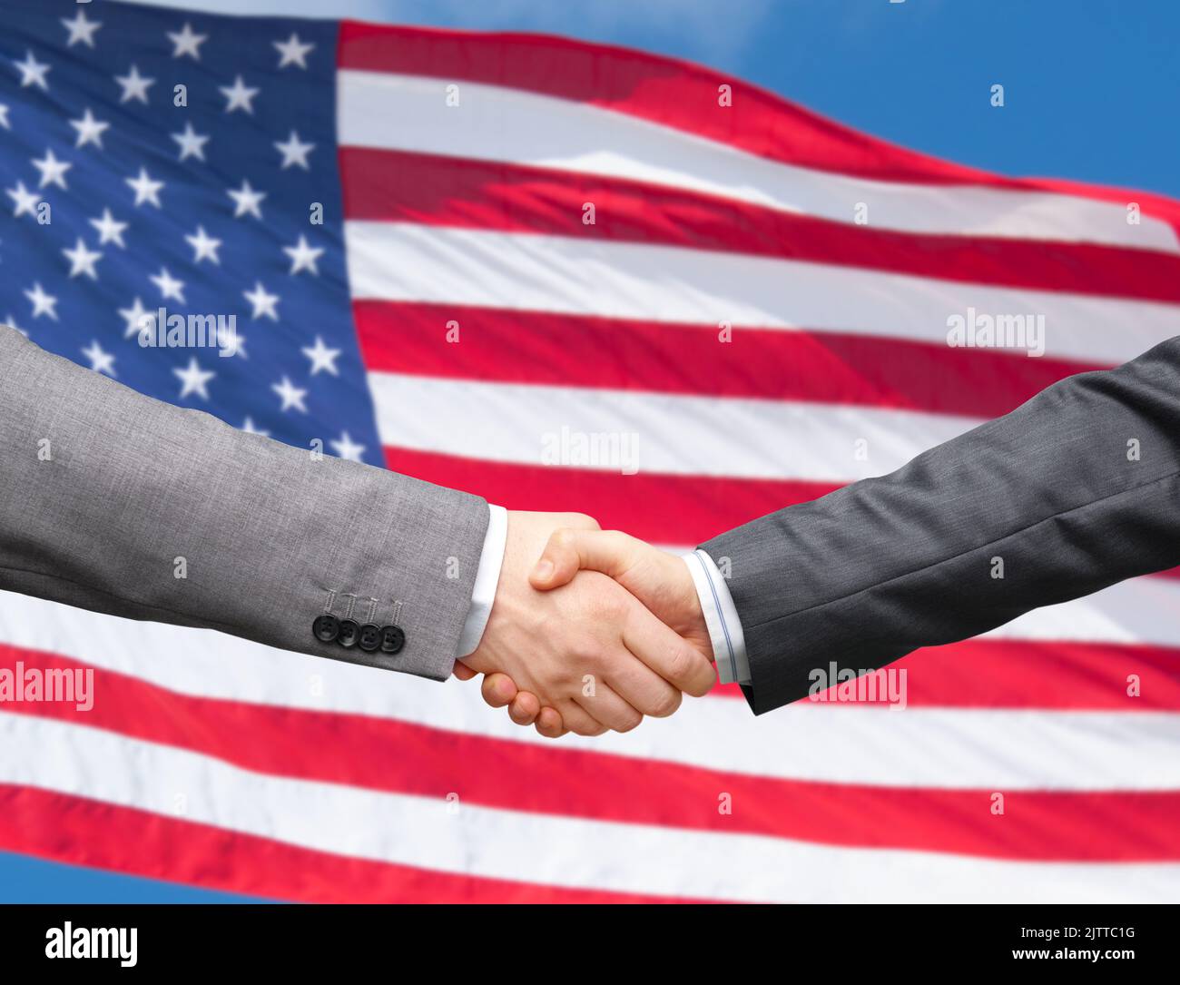 handshake over flag of united states of america Stock Photo - Alamy