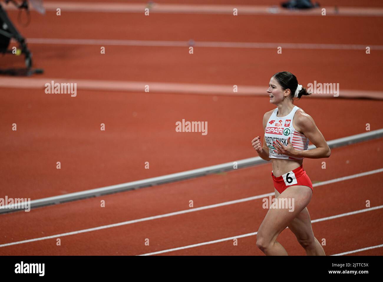 Pia Skrzyszowska with her country's flag as the winner of the 100 ...