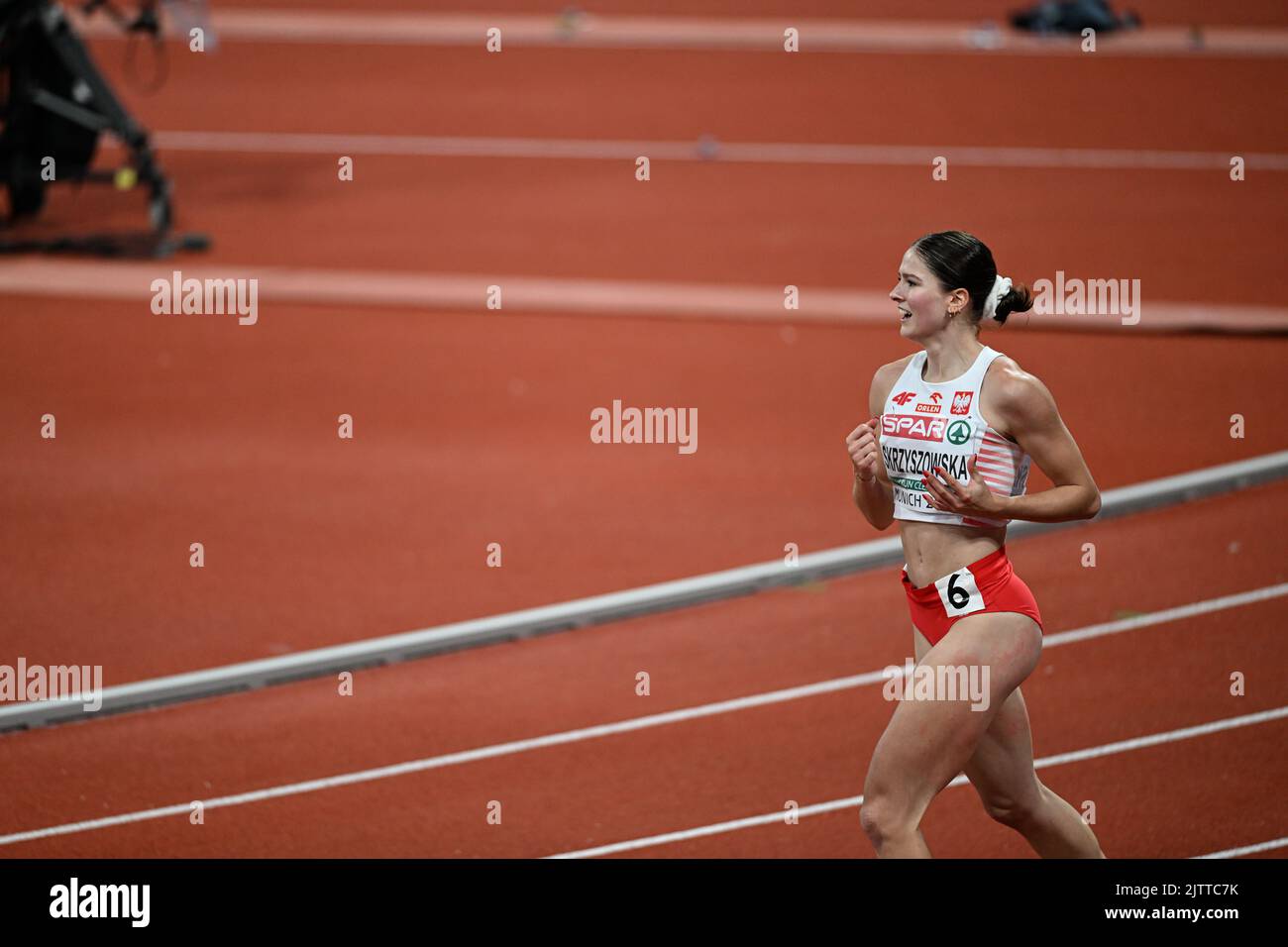 Pia Skrzyszowska with her country's flag as the winner of the 100 ...