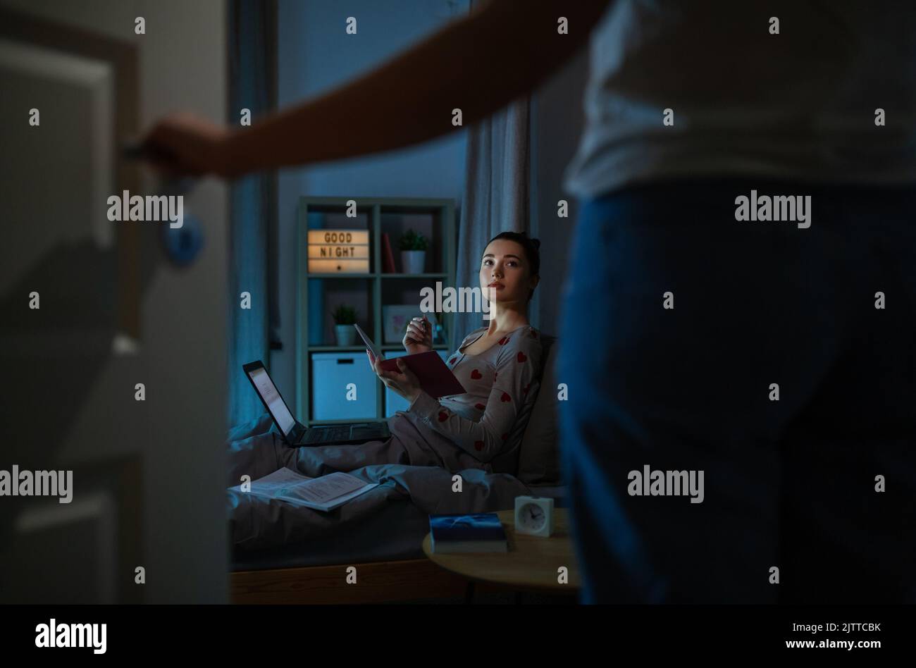 student girl with laptop learning at night Stock Photo - Alamy