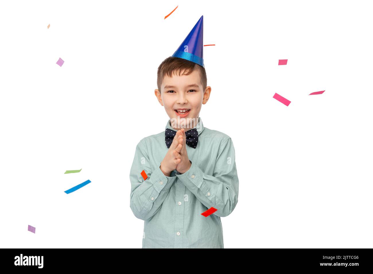smiling boy in birthday party hat clapping hands Stock Photo - Alamy