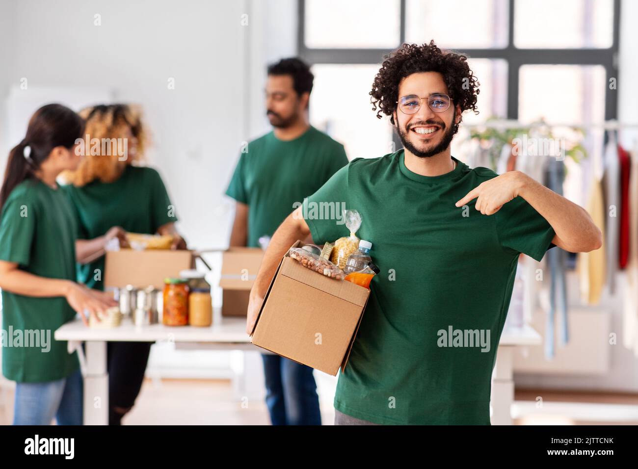 Man giving donation boxes hi-res stock photography and images - Alamy