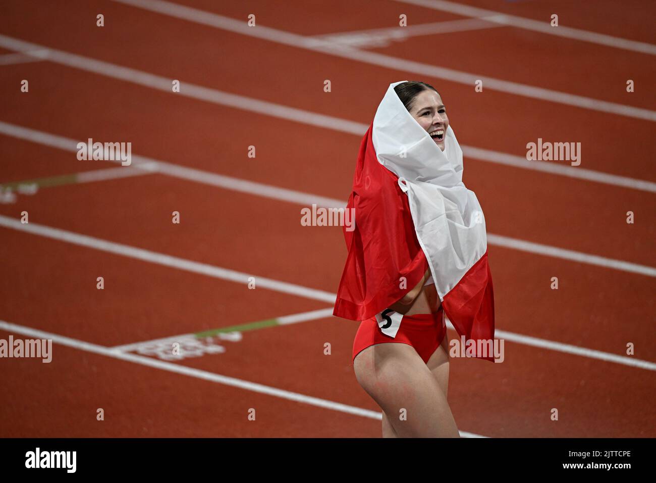 Pia Skrzyszowska with her country's flag as the winner of the 100 ...