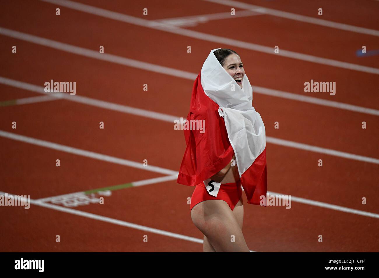 Pia Skrzyszowska with her country's flag as the winner of the 100 ...