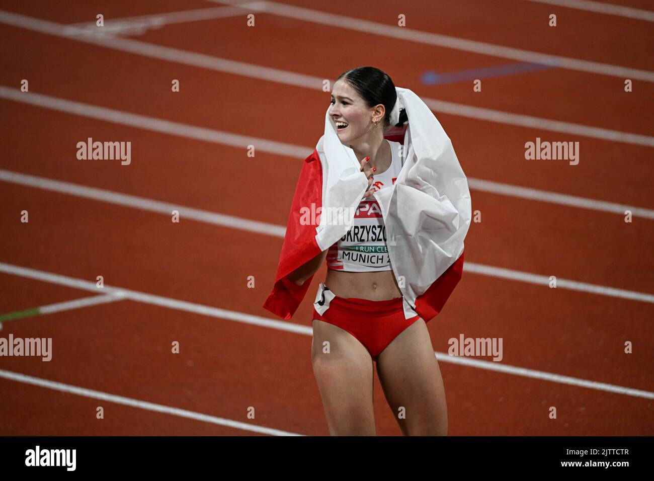 Pia Skrzyszowska with her country's flag as the winner of the 100 ...