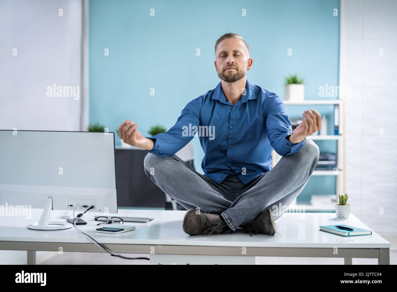 Employee Doing Mental Health Yoga Meditation In Office Stock Photo - Alamy