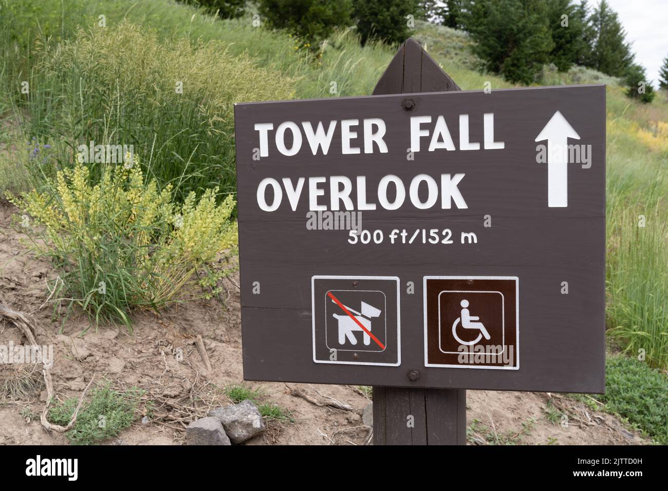Sign giving directions to hikers to the Tower Fall Overlook, a famous ...