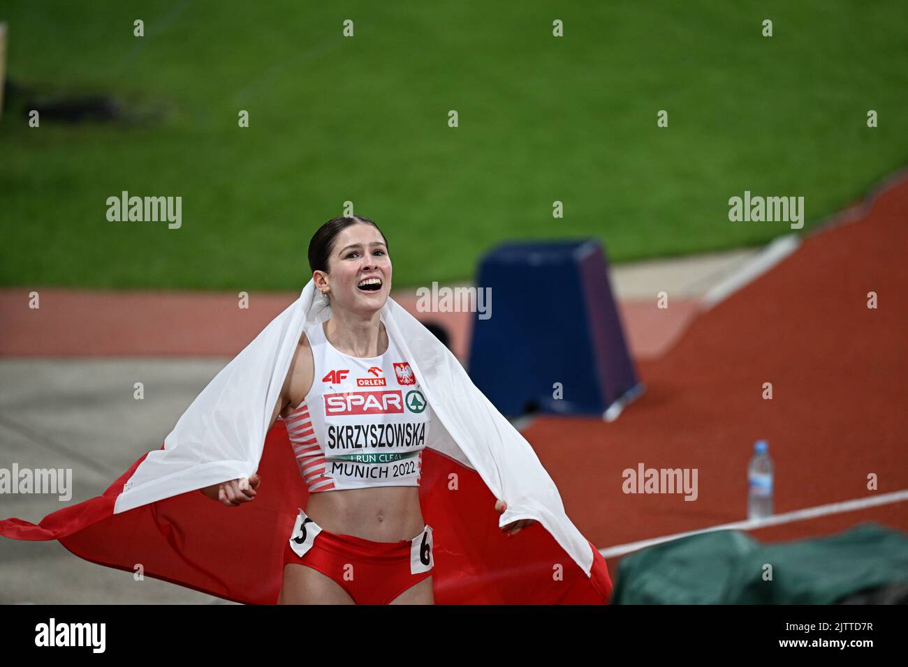 Pia Skrzyszowska with her country's flag as the winner of the 100 ...