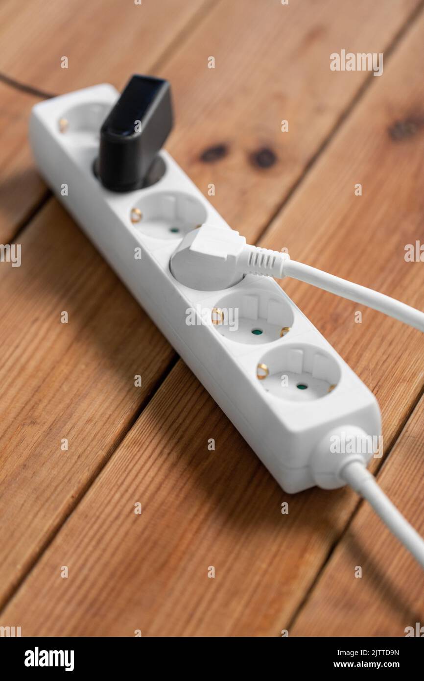 close up of socket with plugs and charger on floor Stock Photo - Alamy