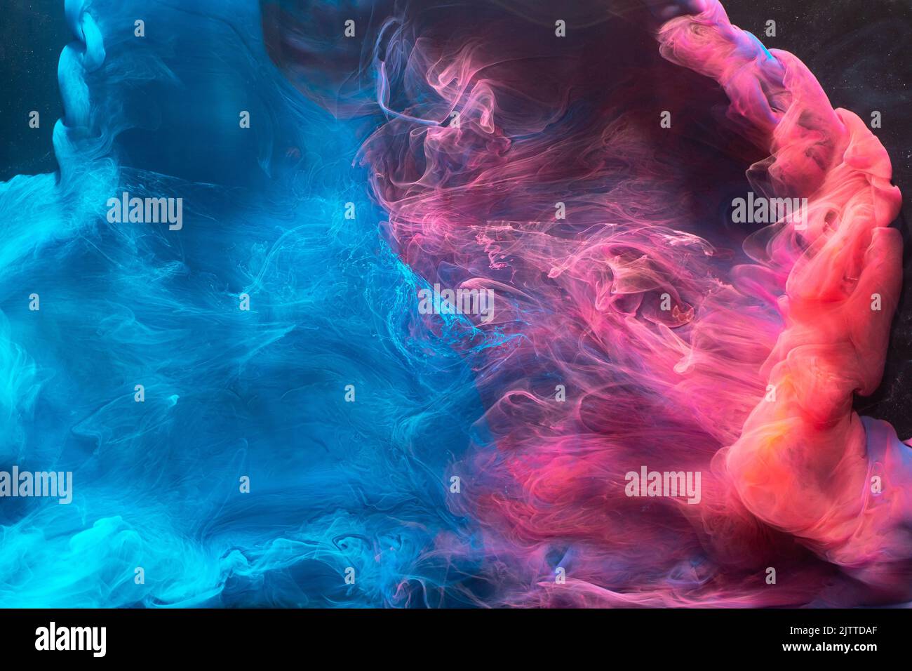 ink water mix fantasy waves blue pink fluid flow Stock Photo - Alamy