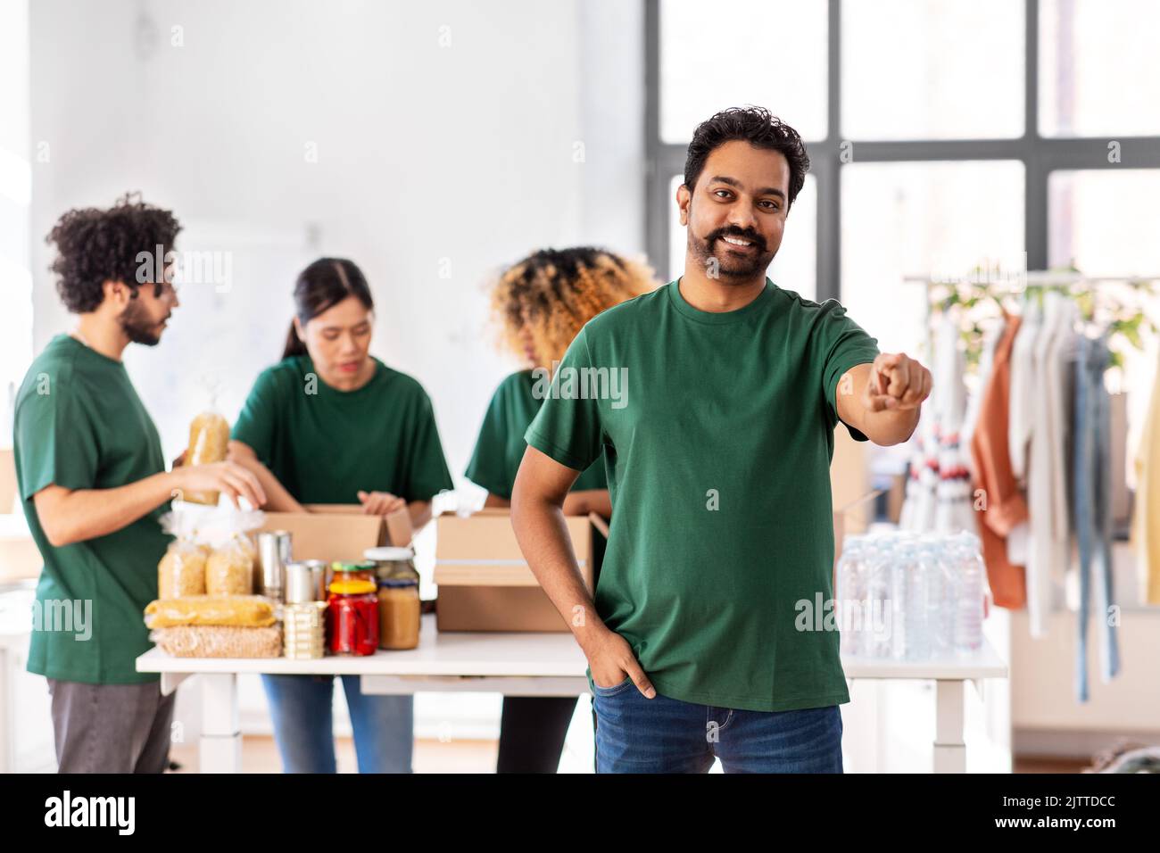 happy volunteers packing food in donation boxes Stock Photo - Alamy