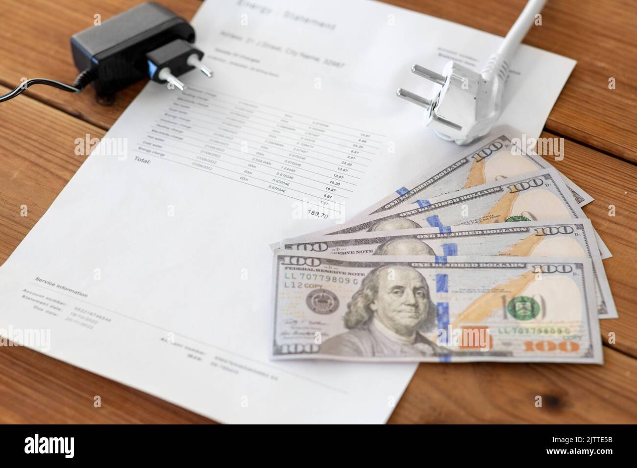 utility bill, money and electric plugs on table Stock Photo - Alamy