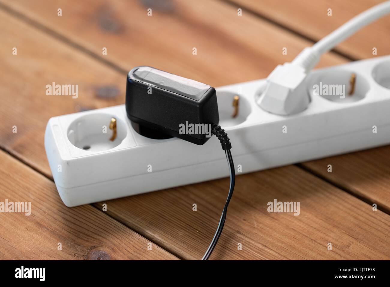 close up of socket with plugs and charger on floor Stock Photo - Alamy