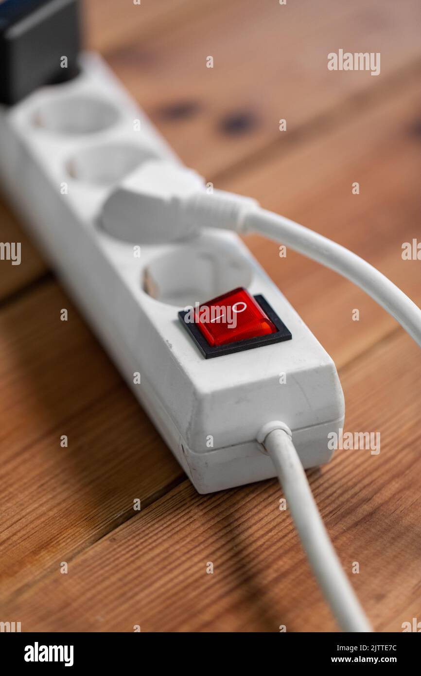 close up of socket with plugs and charger on floor Stock Photo - Alamy