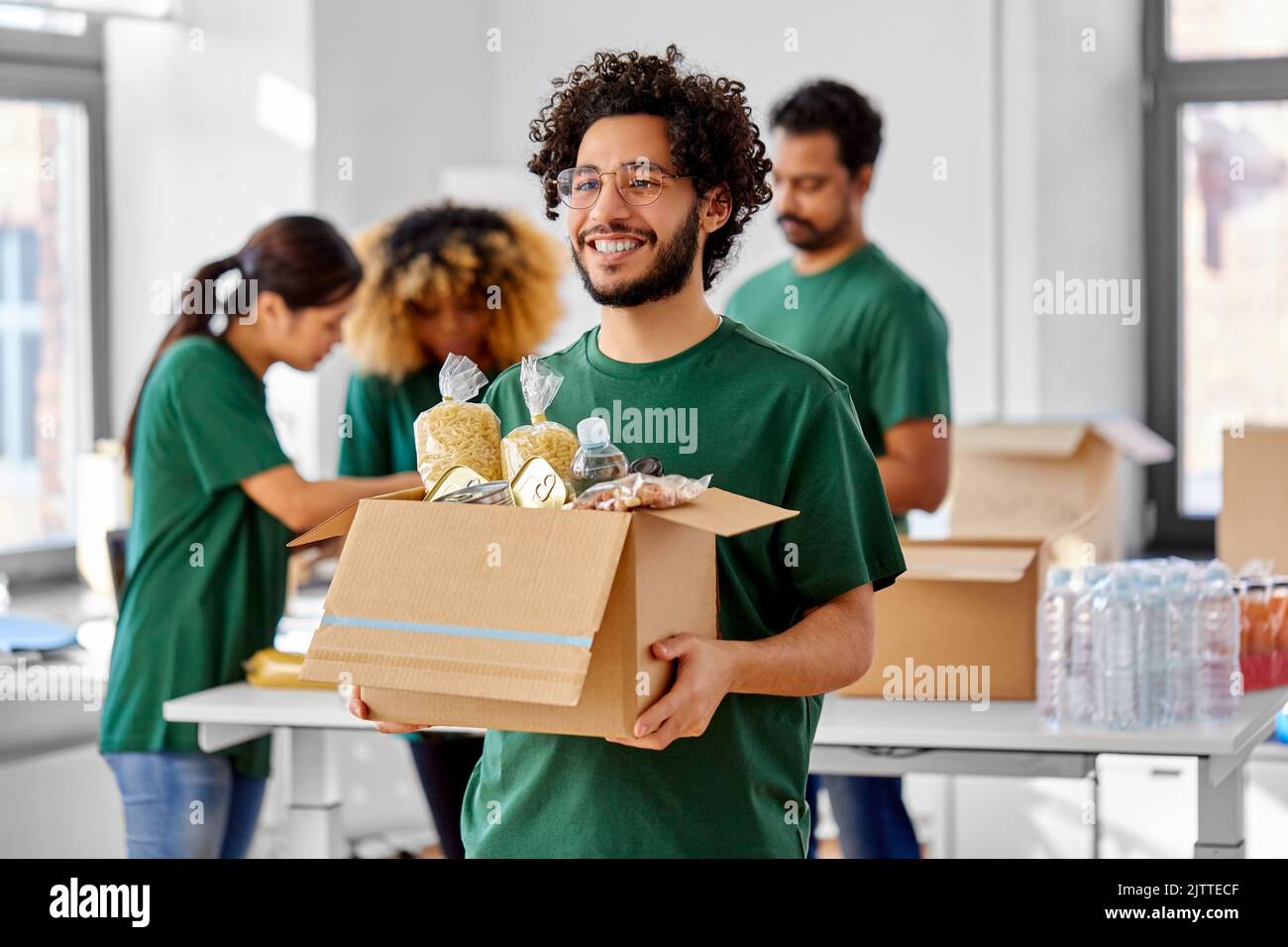Man giving donation boxes hi-res stock photography and images - Alamy