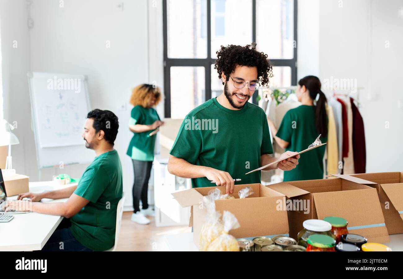 Man giving donation boxes hi-res stock photography and images - Alamy