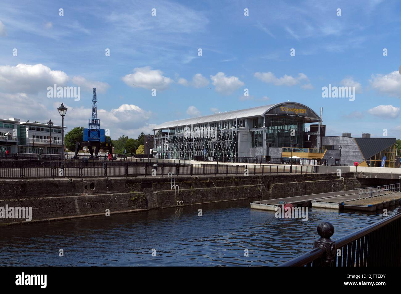 Disused blue dock derrick near Mermaid Quay and Techniquest building ...
