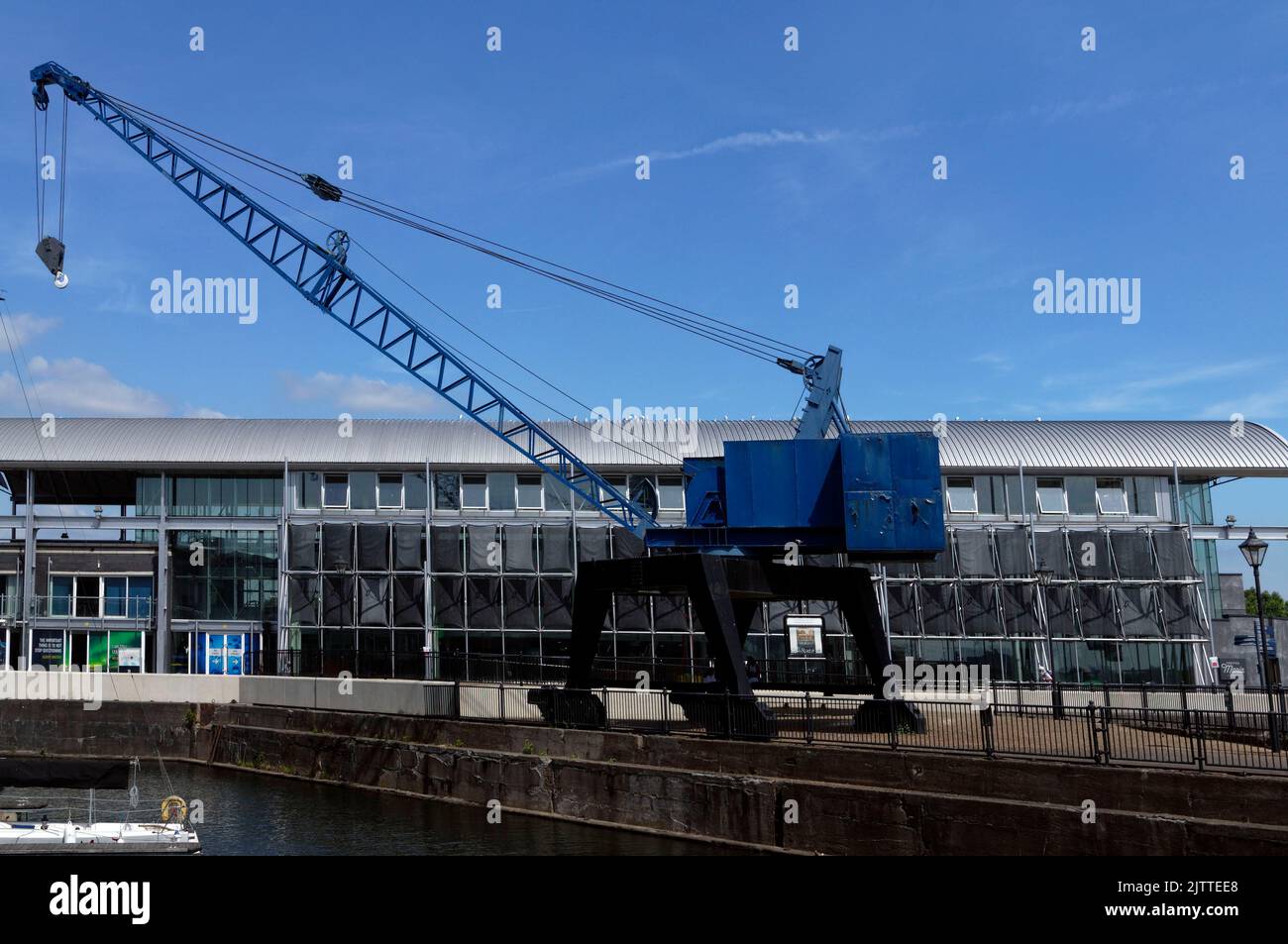 Disused blue dock derrick at Mermaid Quay near Techniquest building ...