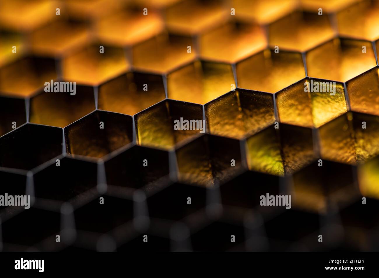 Golden yellow shiny honeycomb grid background Stock Photo - Alamy