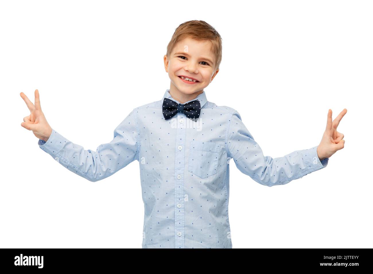 little boy in bowtie showing peace gesture Stock Photo - Alamy
