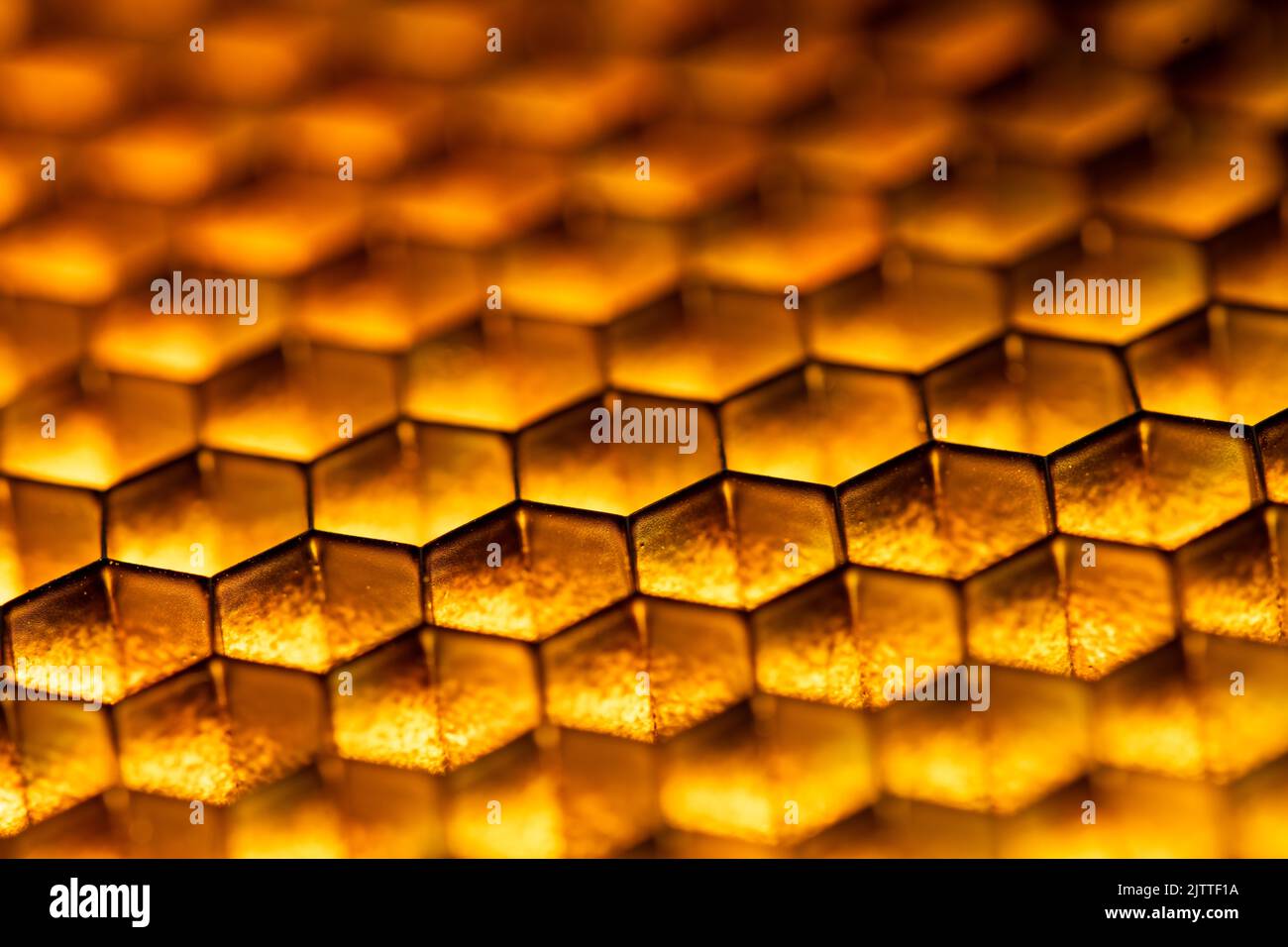 Golden yellow shiny honeycomb grid background Stock Photo - Alamy