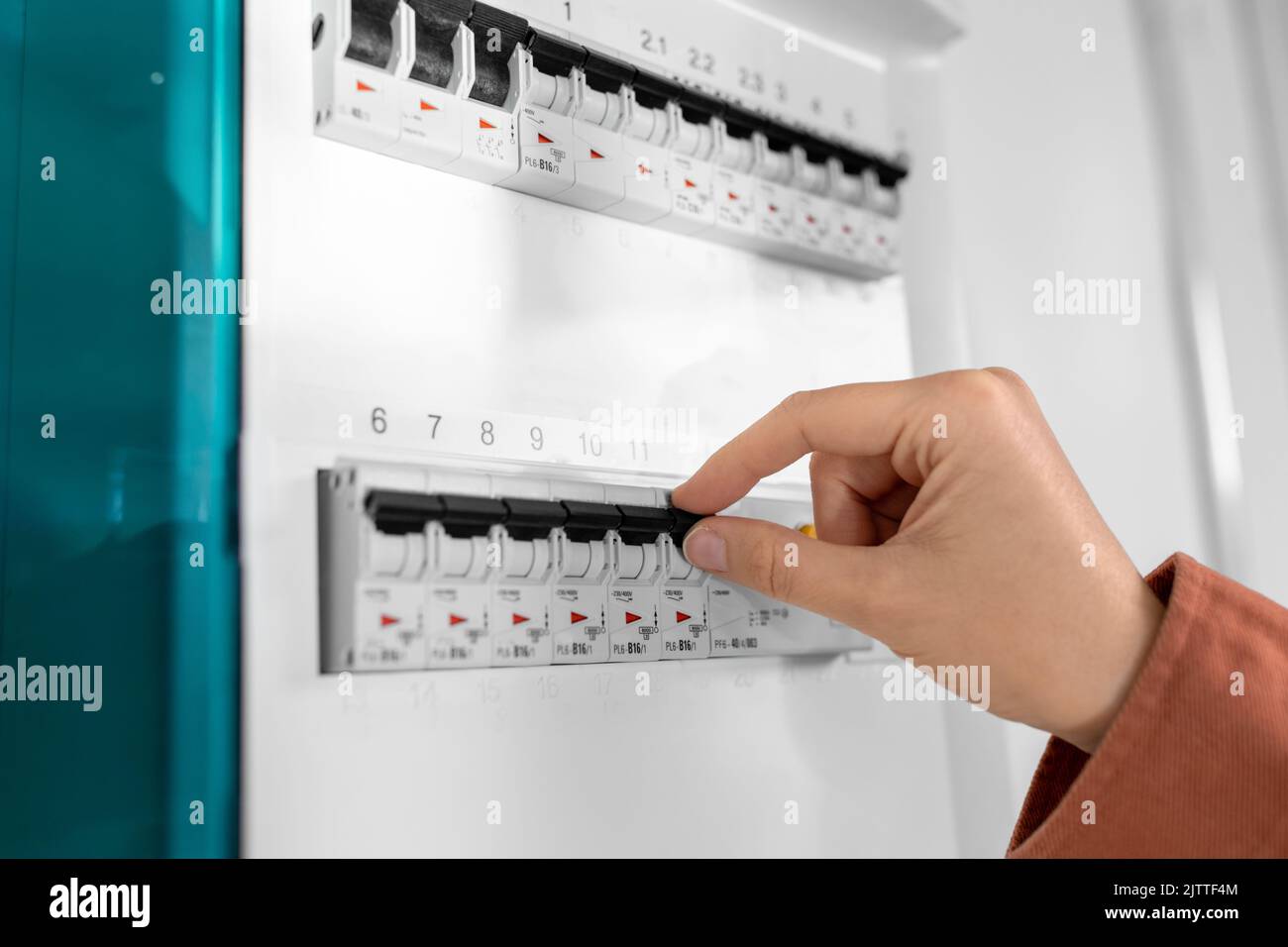 close up of hand switching electric board at home Stock Photo - Alamy