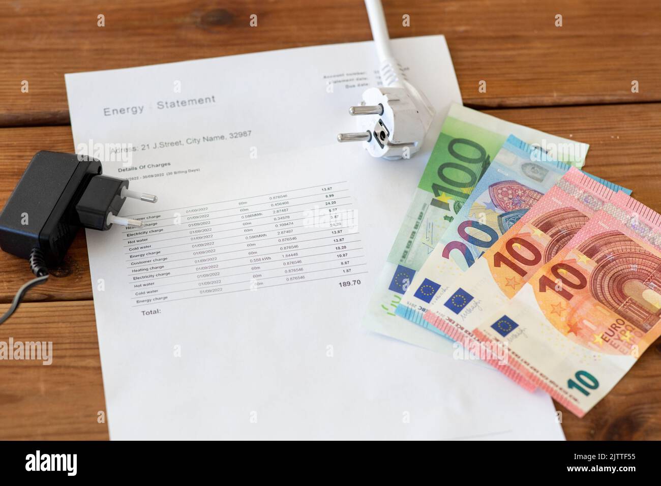 utility bill, money and electric plugs on table Stock Photo - Alamy