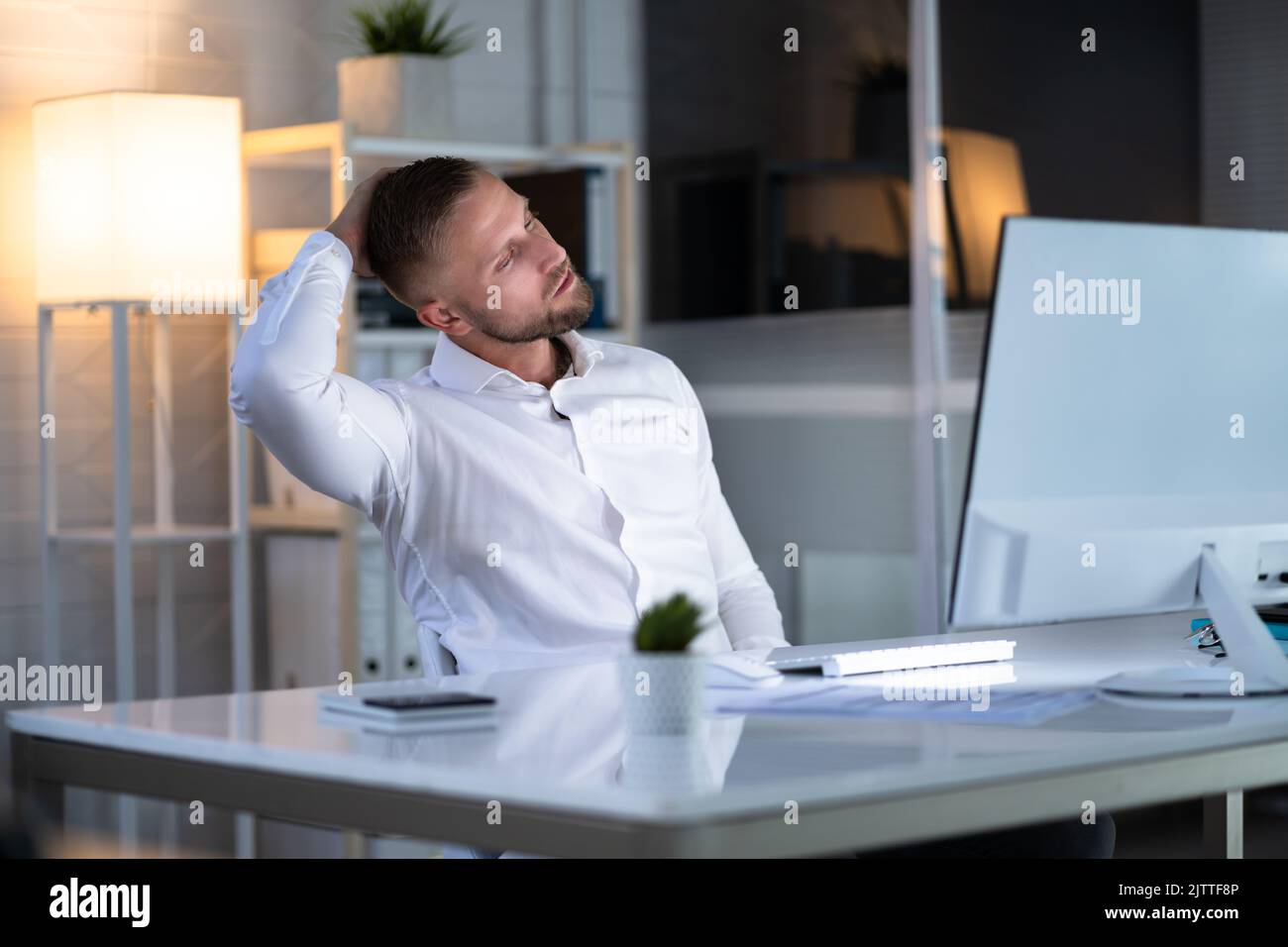 Man Stretching At Office Desk. Worker Stretch Workout Stock Photo - Alamy