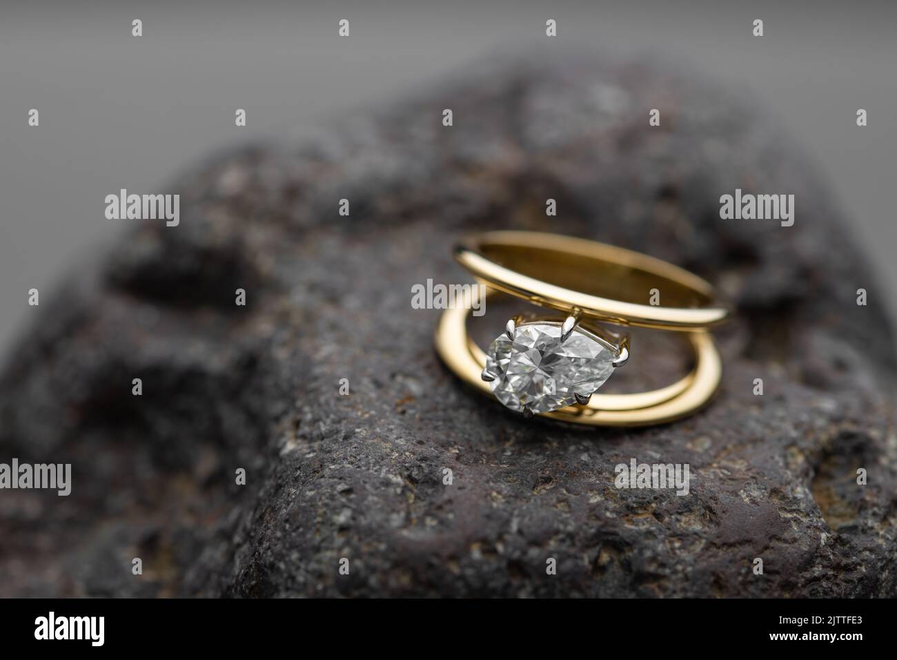Classic Engagement Wedding Ring on Natural Stones Stock Photo - Alamy