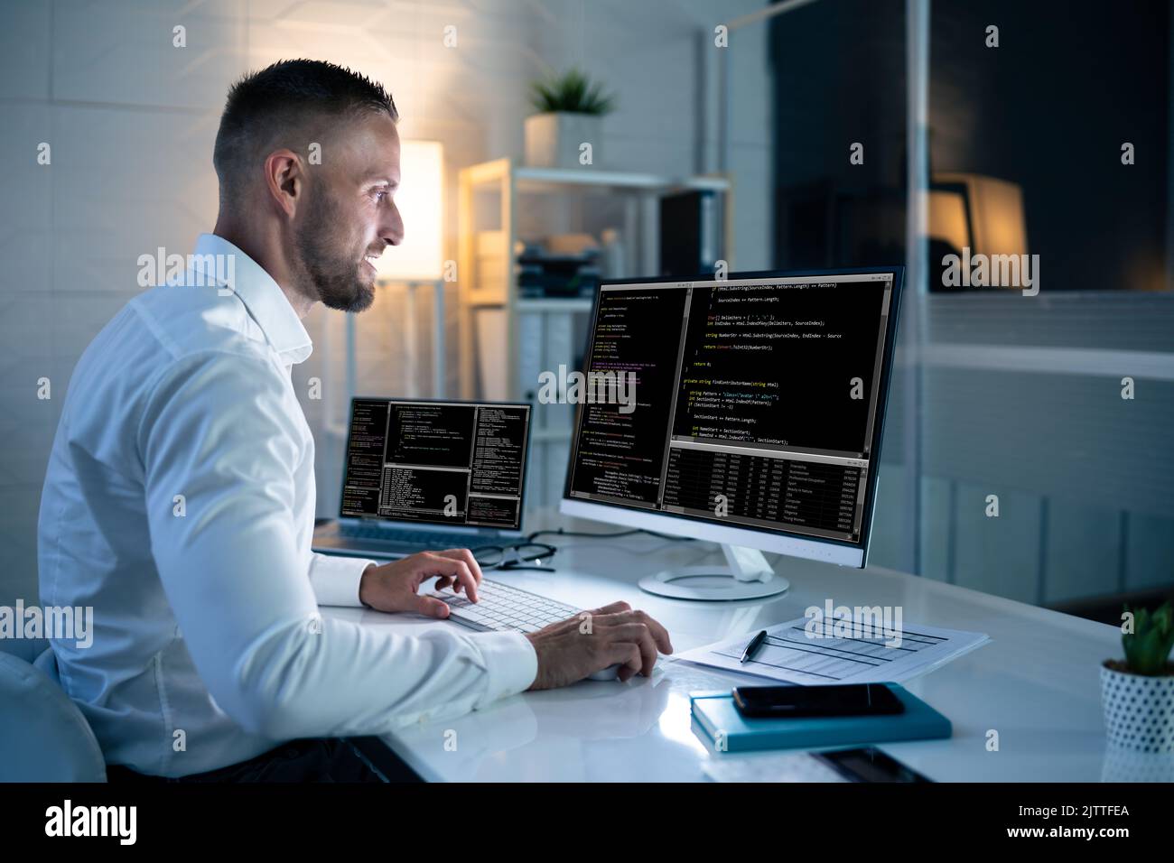 Computer Programmer Writing Program Code On Computer In Office Stock Photo - Alamy