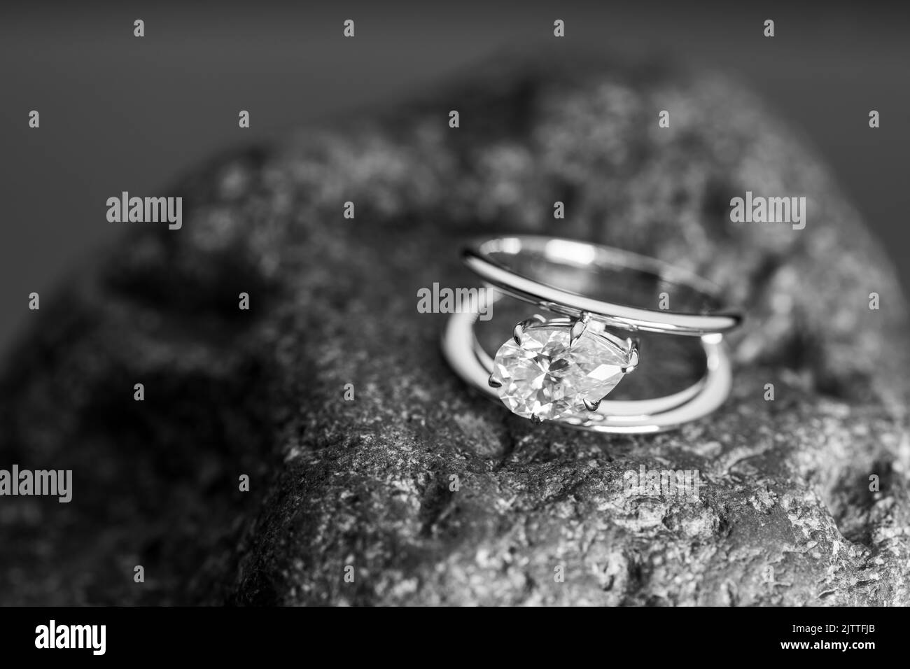 Classic Engagement Wedding Ring on Natural Stones Stock Photo - Alamy