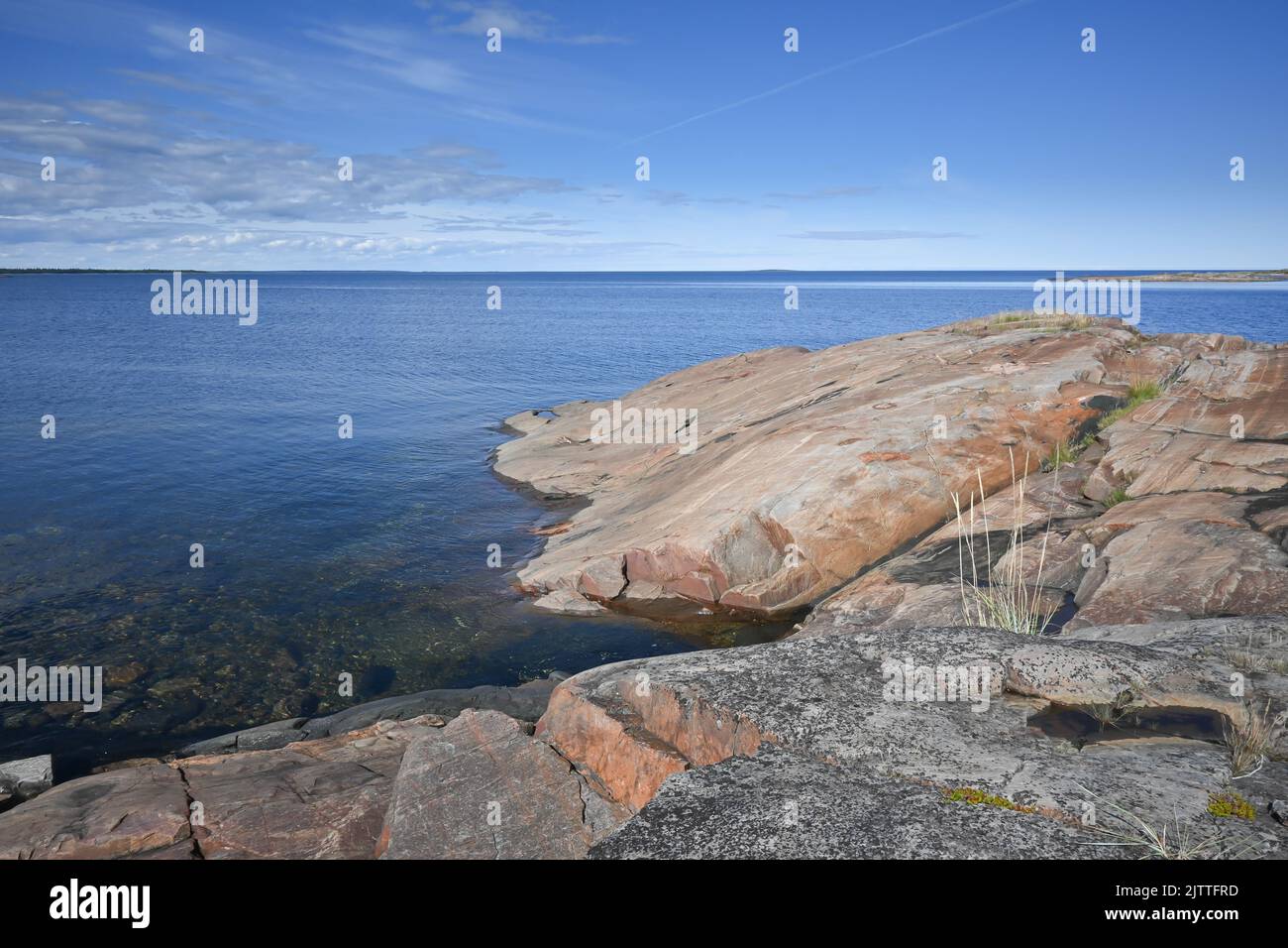 Rocky seashore. Summer landscape of the White Sea. Russia, Republic of ...
