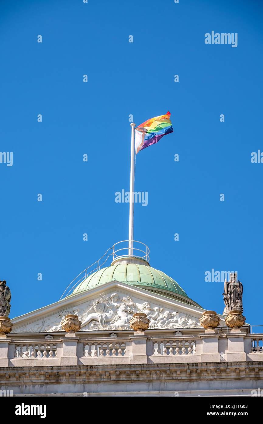 LGBTQ flag flying over the dome of a landmark building in London Stock ...