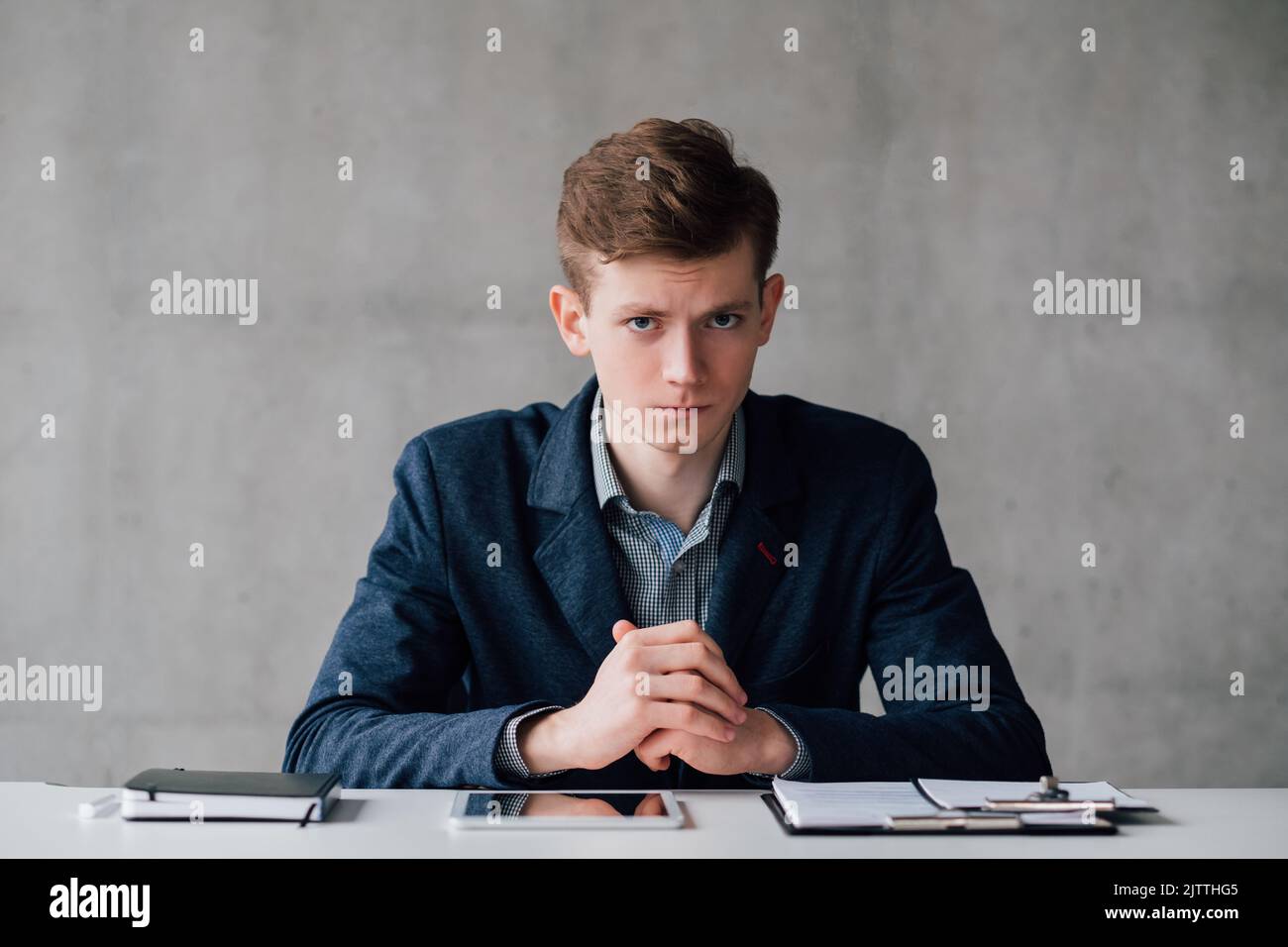 strict judgy disappointed young man work portrait Stock Photo - Alamy