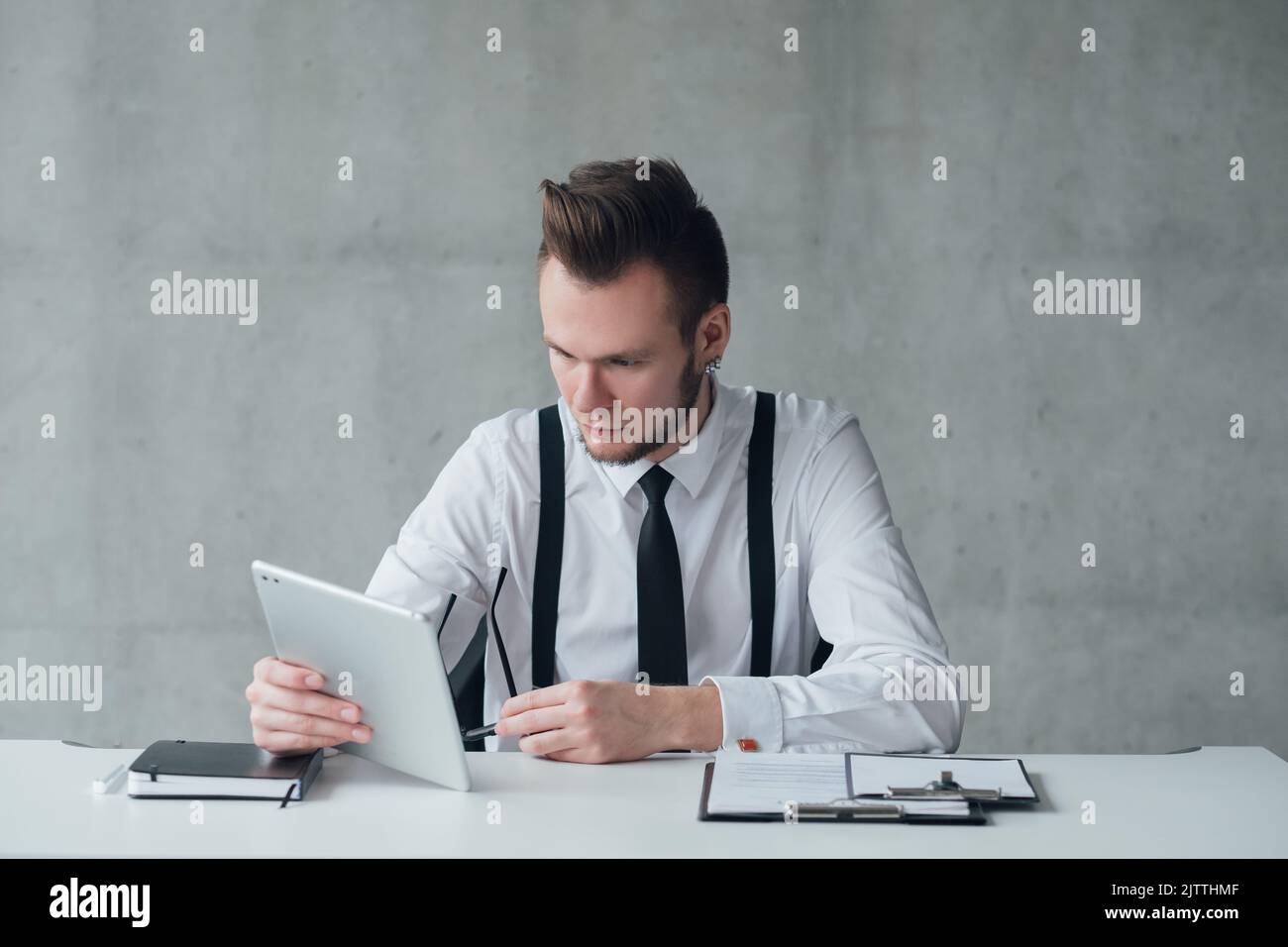 Young manager sitting desk hi-res stock photography and images - Alamy
