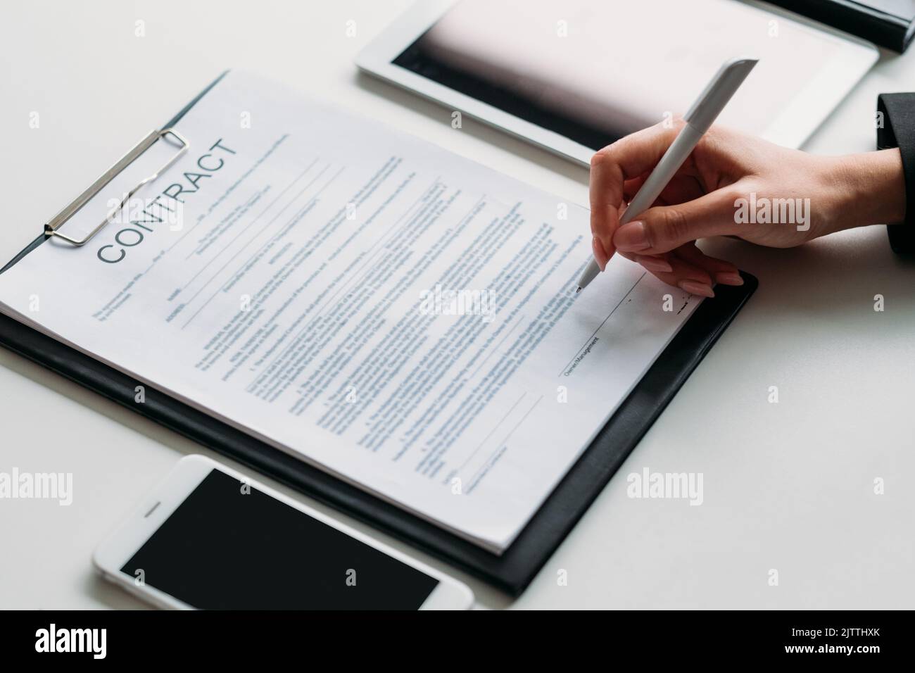 executive decision female leader signing contract Stock Photo - Alamy