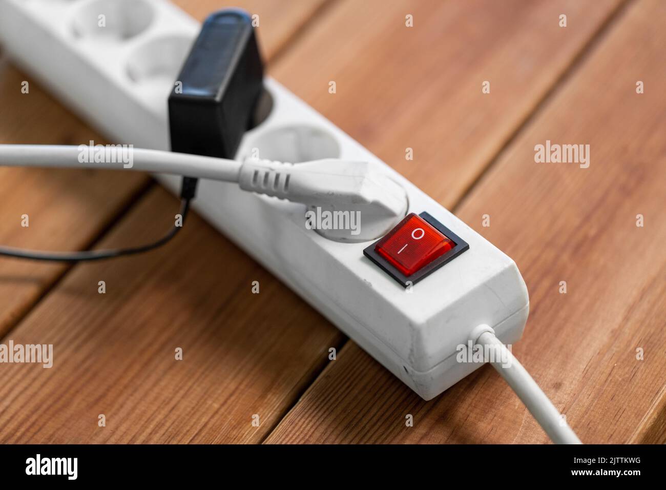 close up of socket with plugs and charger on floor Stock Photo - Alamy