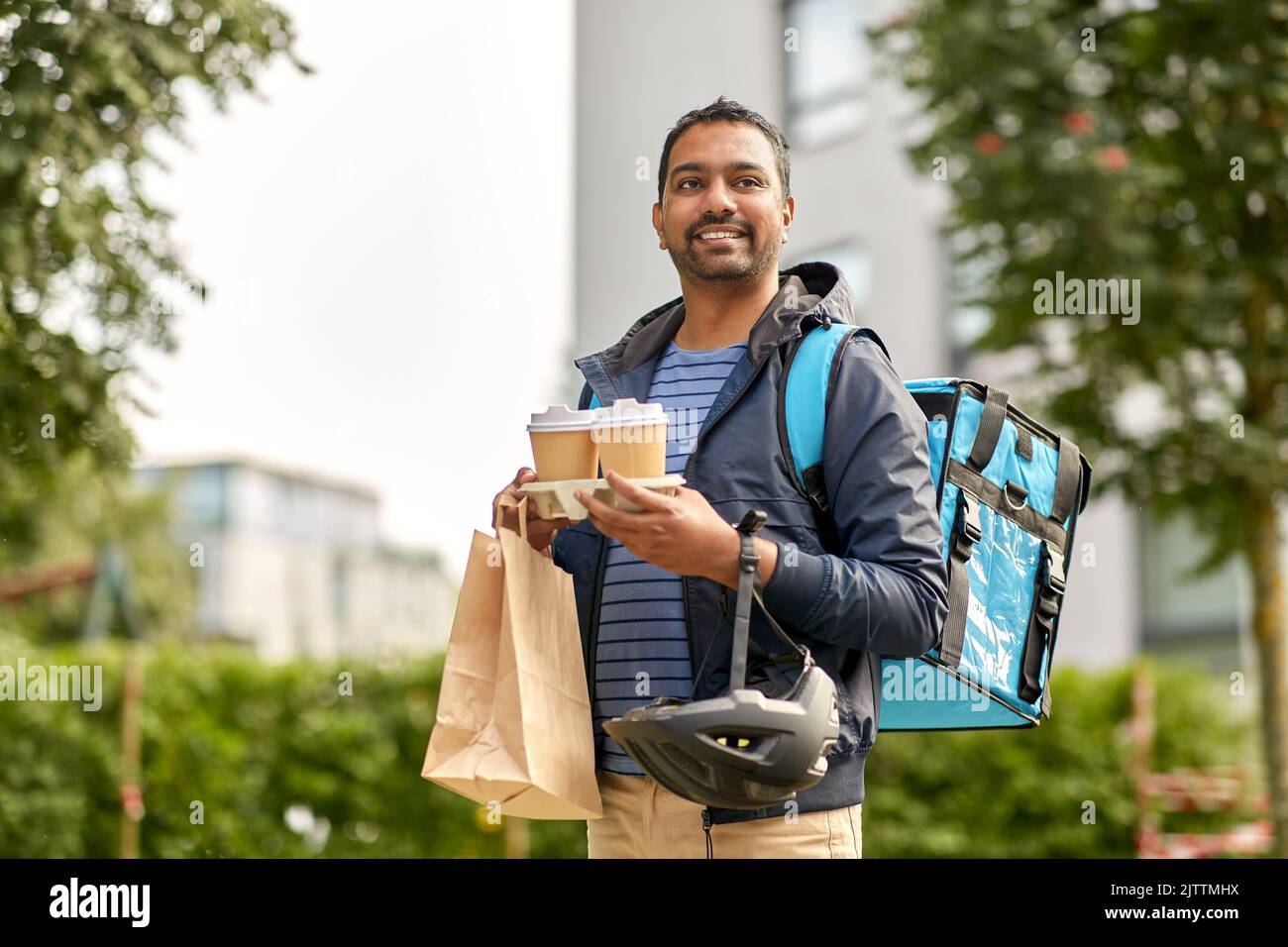food delivery man with bag and takeaway coffee Stock Photo - Alamy