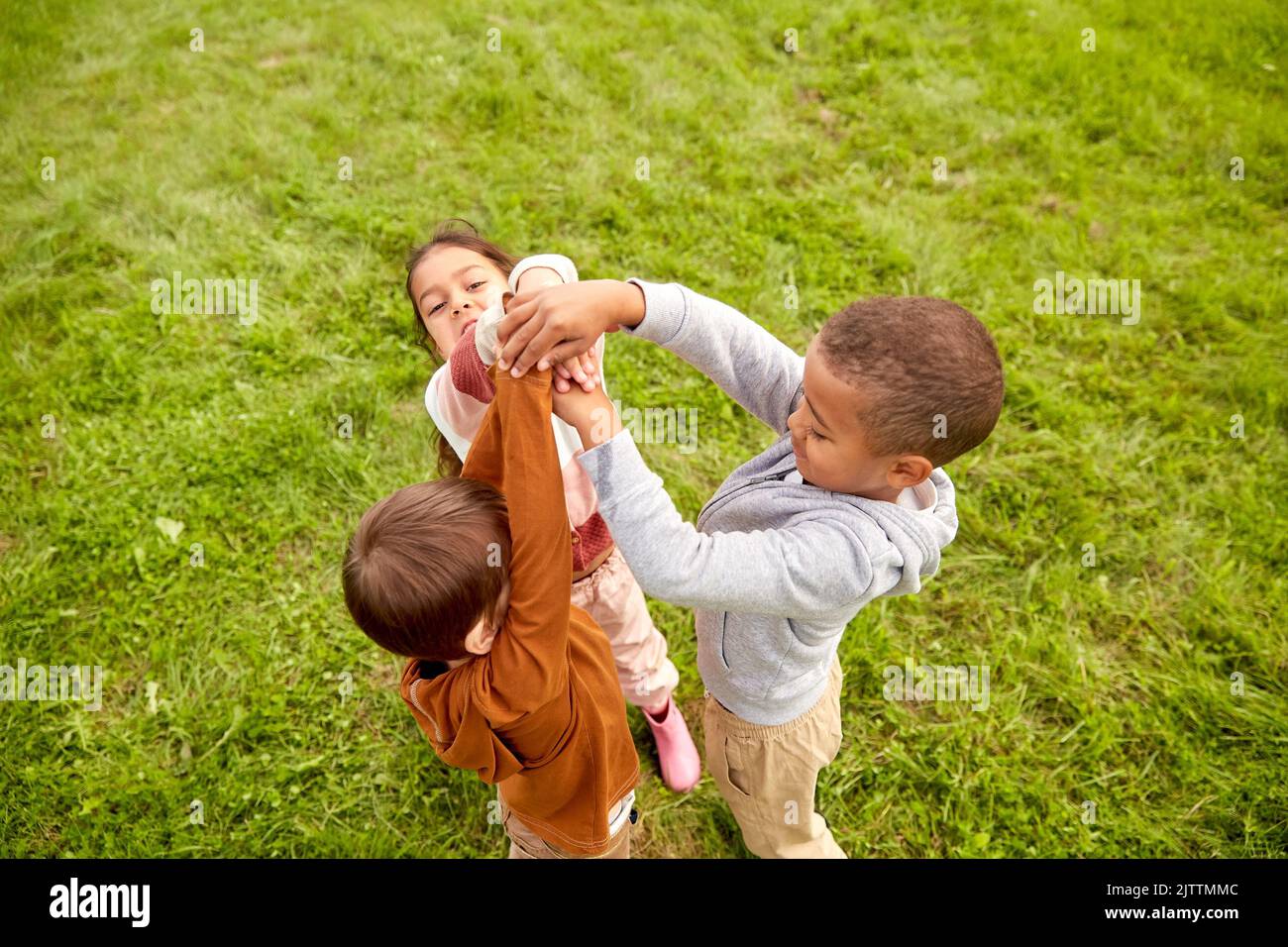 group of children playing game at park Stock Photo - Alamy