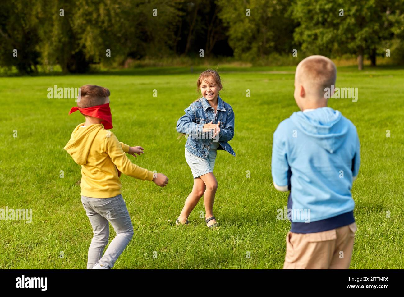 happy children playing and running at park Stock Photo - Alamy