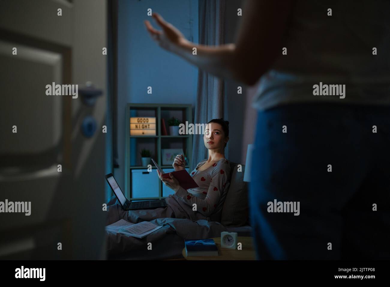 student girl with laptop learning at night Stock Photo - Alamy