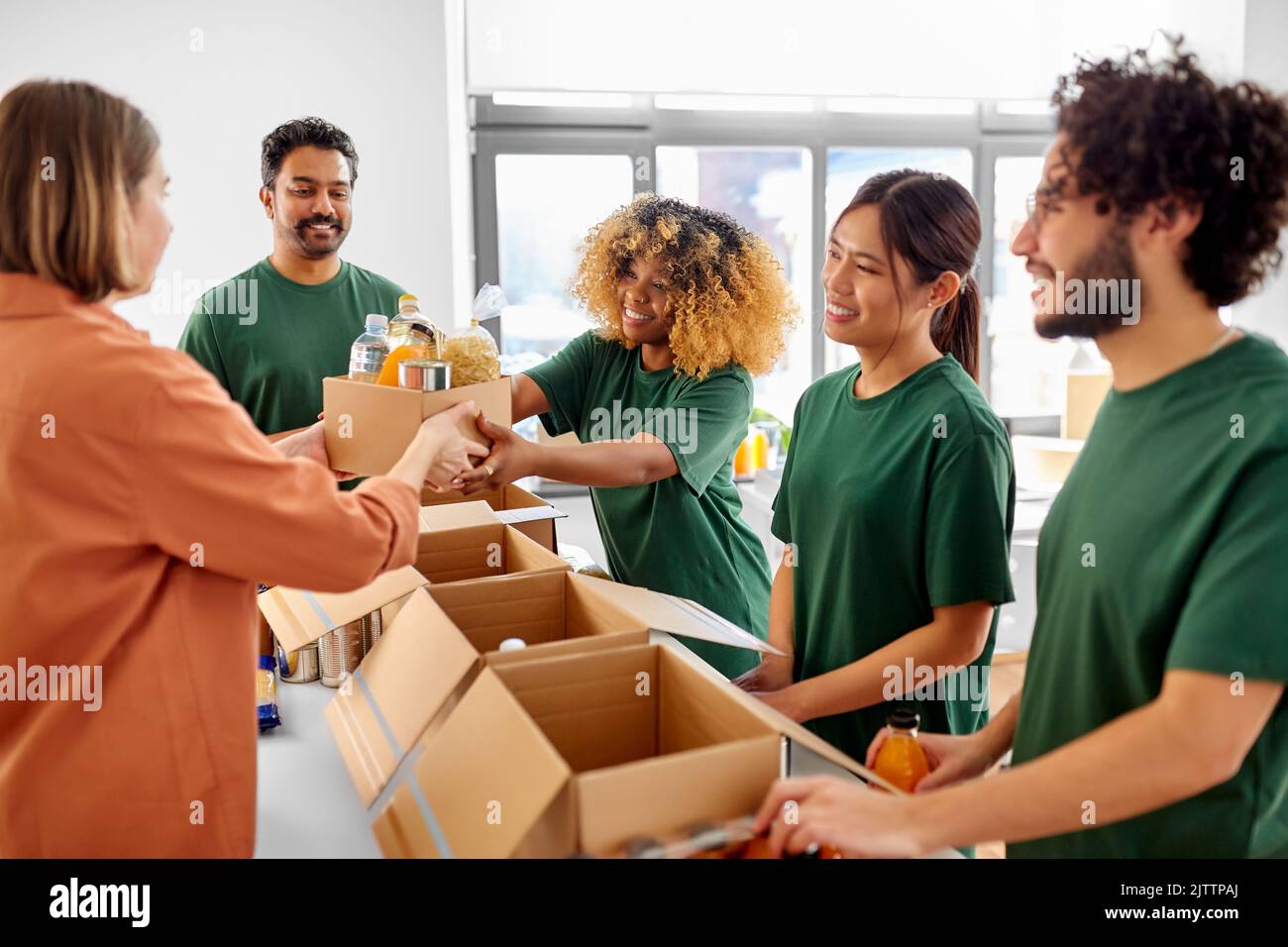 Man woman packing donation boxes hi-res stock photography and images ...